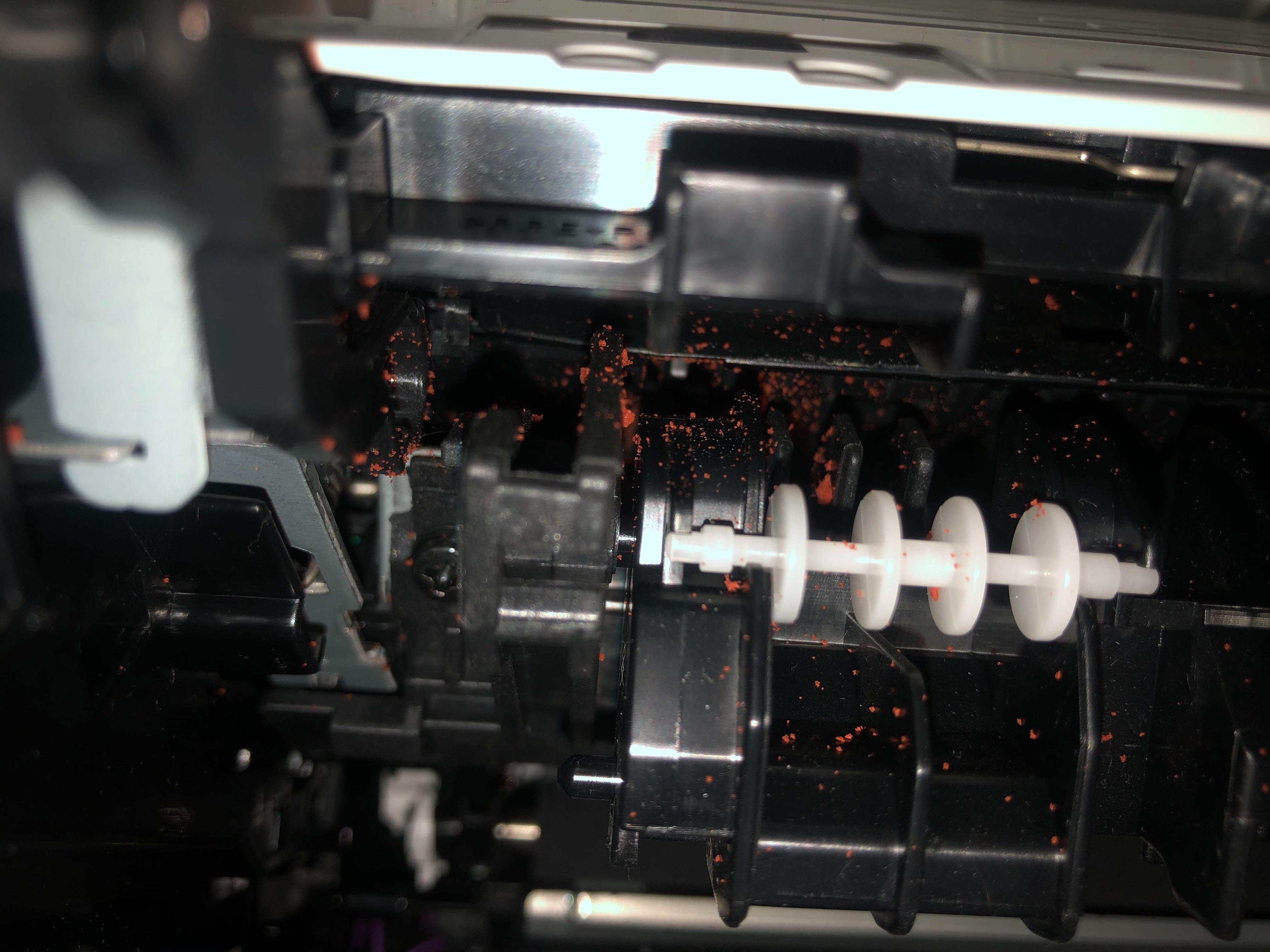 Solved: Crinkling sound, red powder, and torn film inside printer - HP ...
