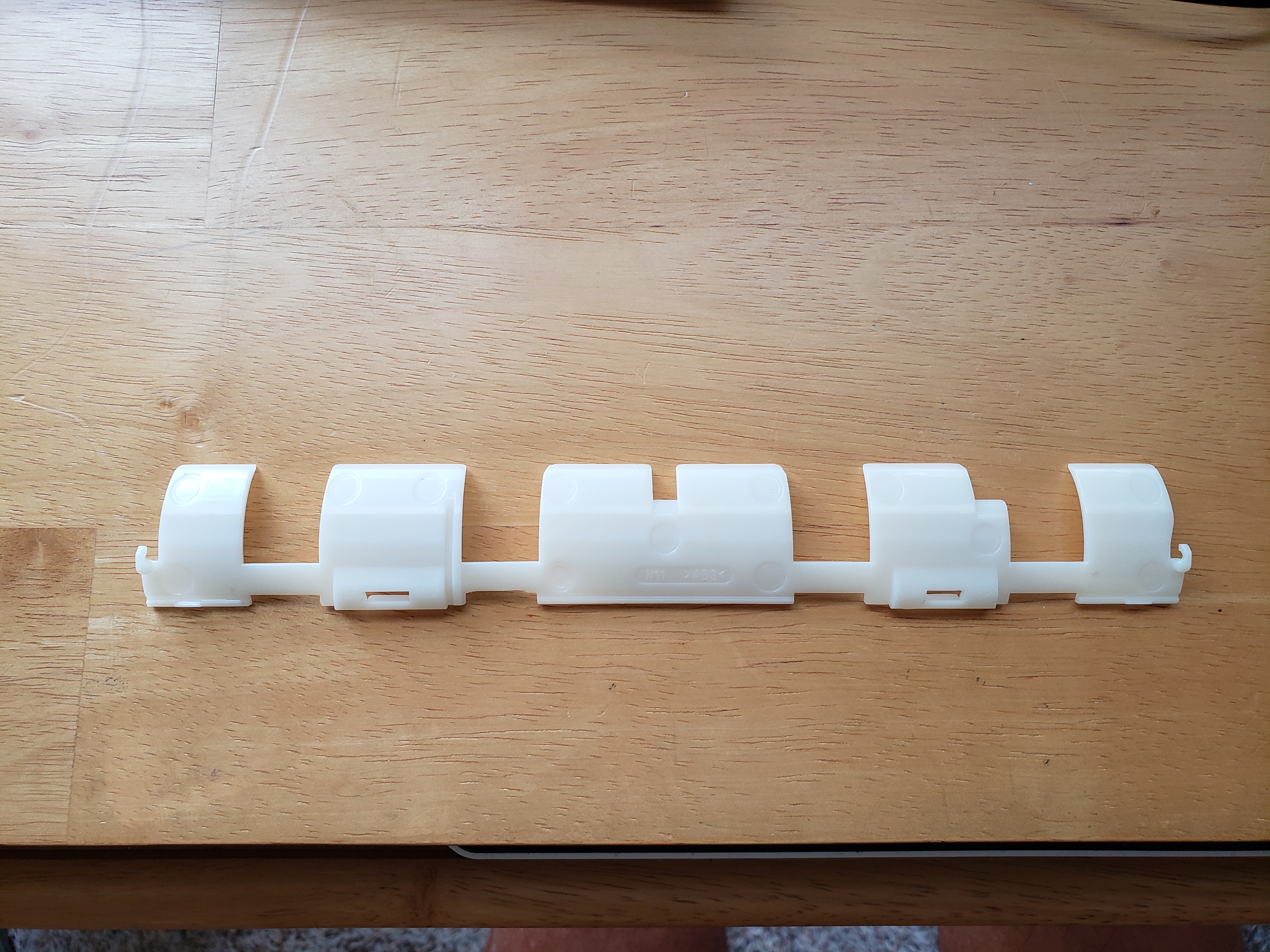 while removing a paper jam, a white plastic part fell off of... - HP ...