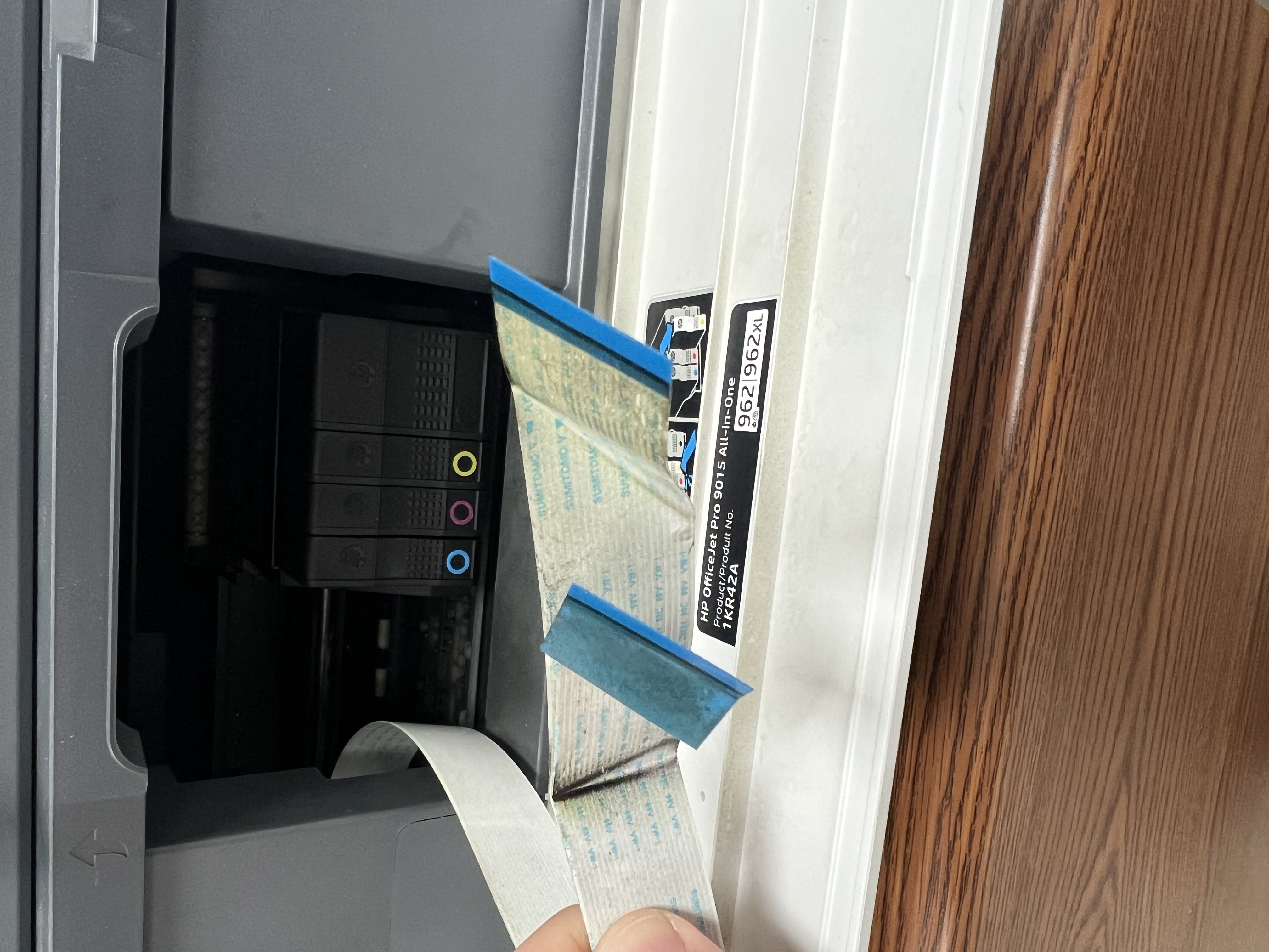 I need to reattach the plastic strip to my printer - HP Support ...