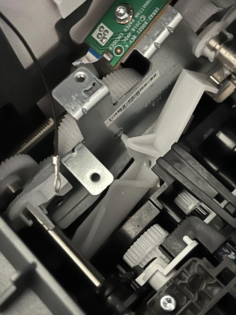 There is a loose piece of plastic in my new HP 7301. My Att... - HP ...